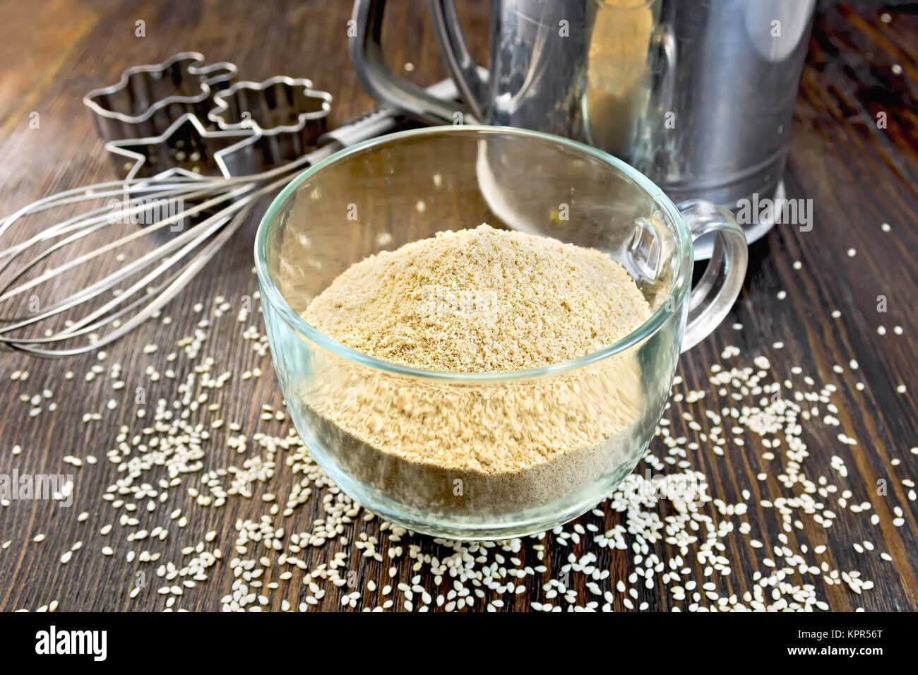 Flour sesame in cup with sieve and mixer on board Stock Photo - Alamy