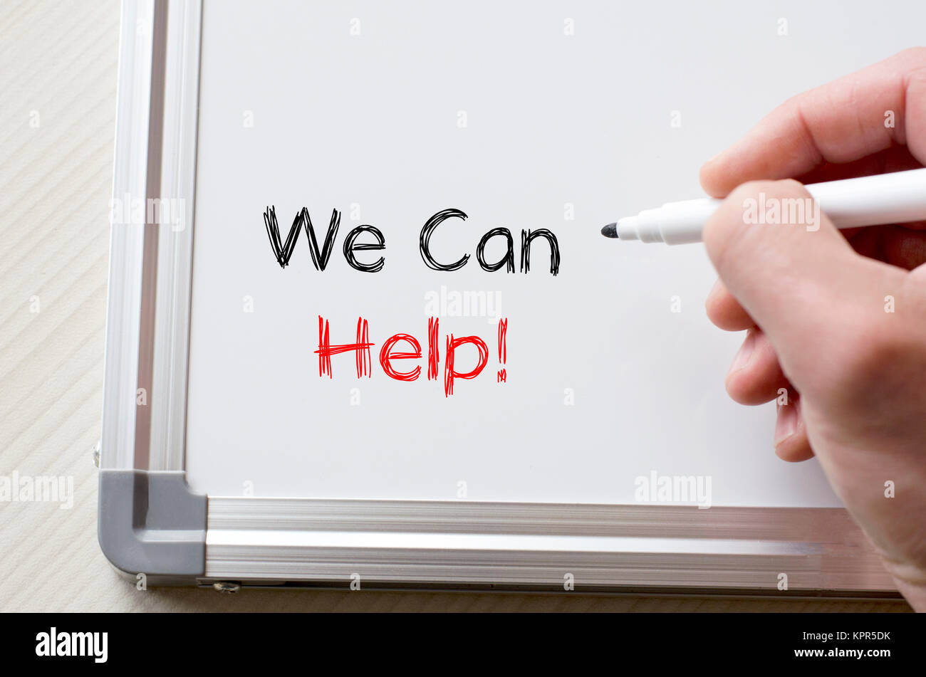 We can help written on whiteboard Stock Photo - Alamy