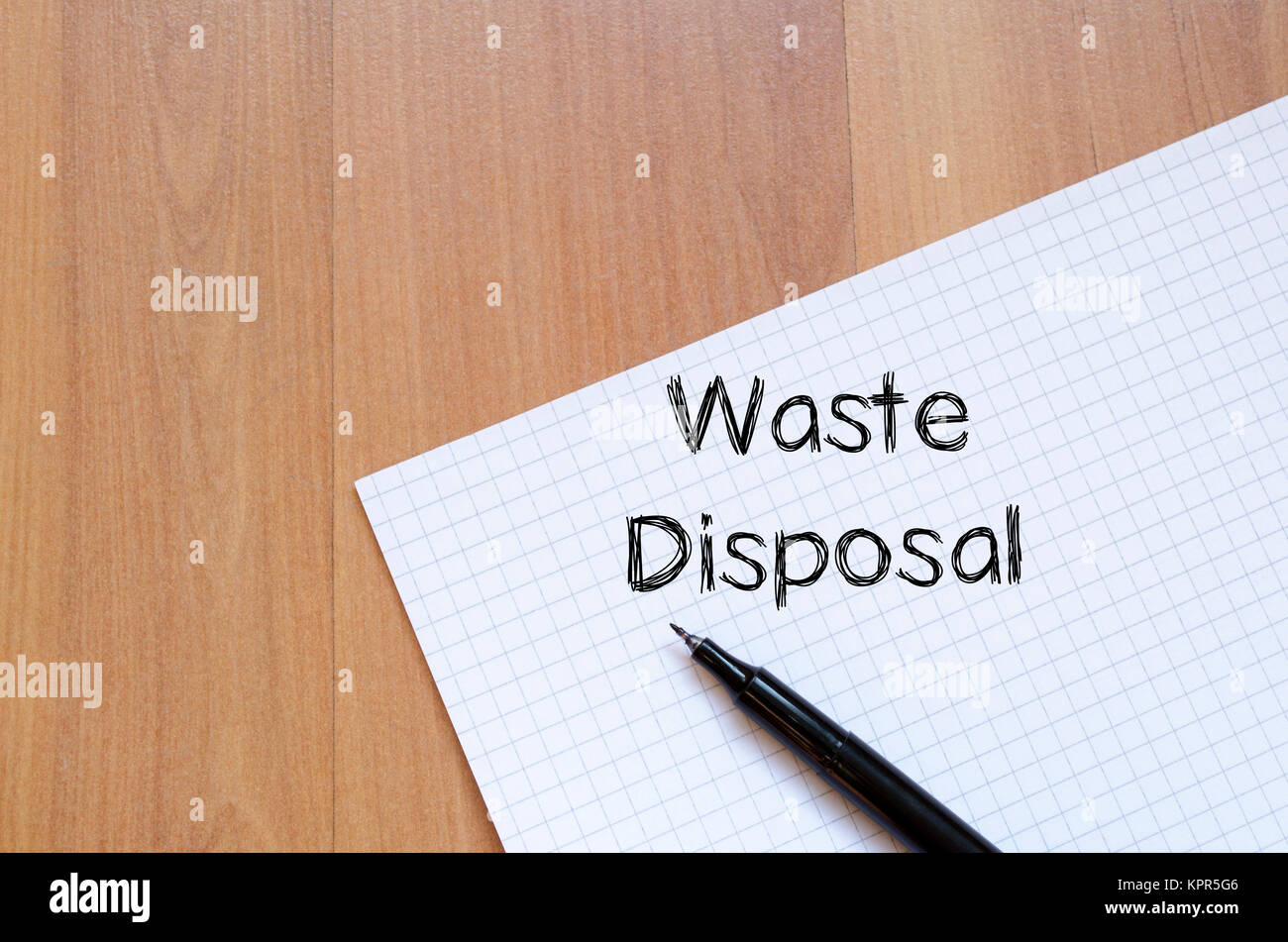 Waste disposal write on notebook Stock Photo - Alamy