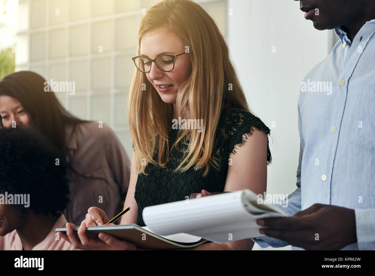 Two diverse female colleagues looking hi-res stock photography and ...