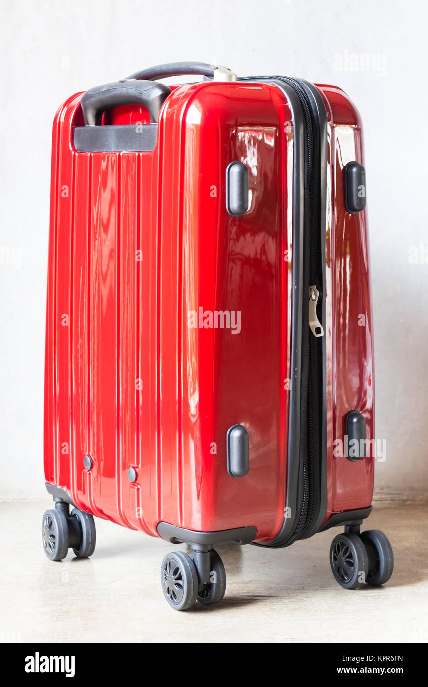 Red travel suitcase for outgoing Stock Photo - Alamy