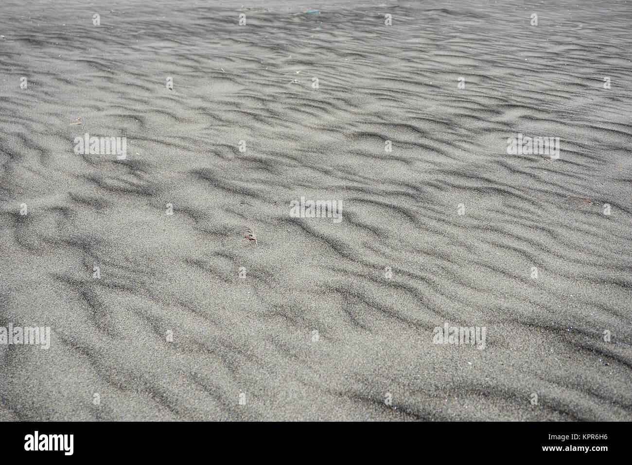 grey sand with wave structure Stock Photo - Alamy