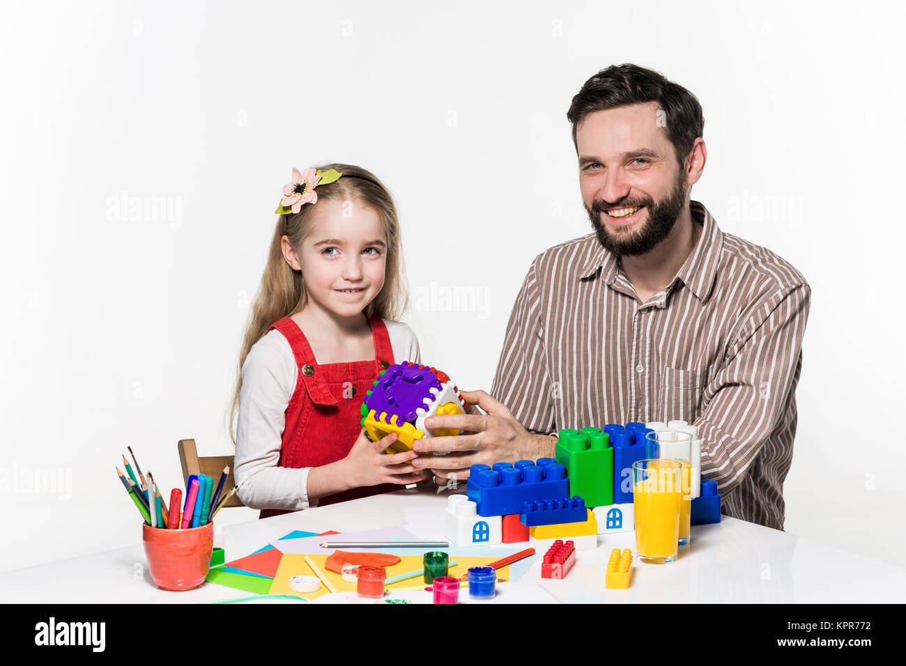 Father and daughter playing educational games together Stock Photo - Alamy