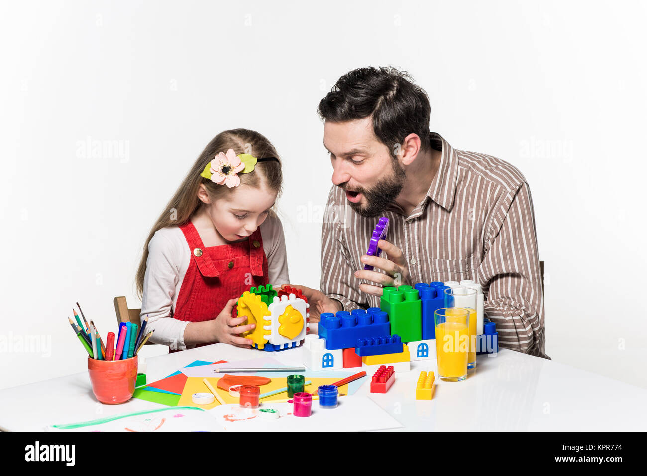 Father and daughter playing educational games together Stock Photo - Alamy