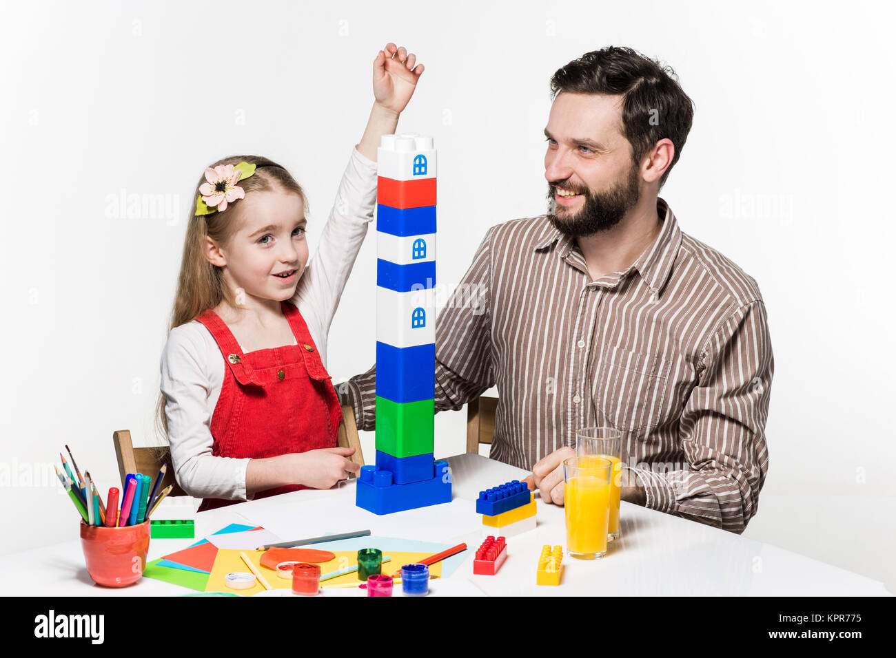 Father and daughter playing educational games together Stock Photo - Alamy