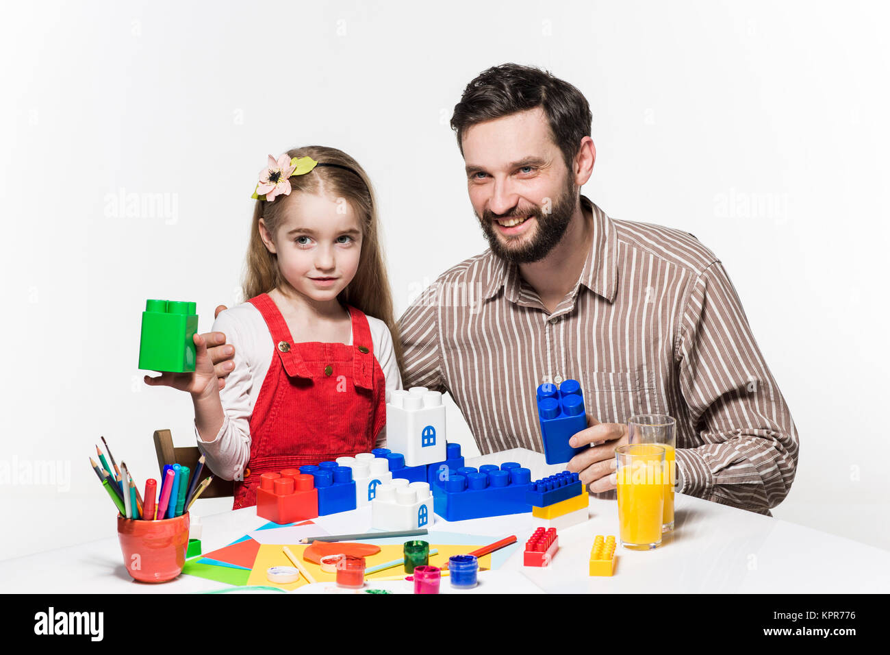 Father and daughter playing educational games together Stock Photo - Alamy