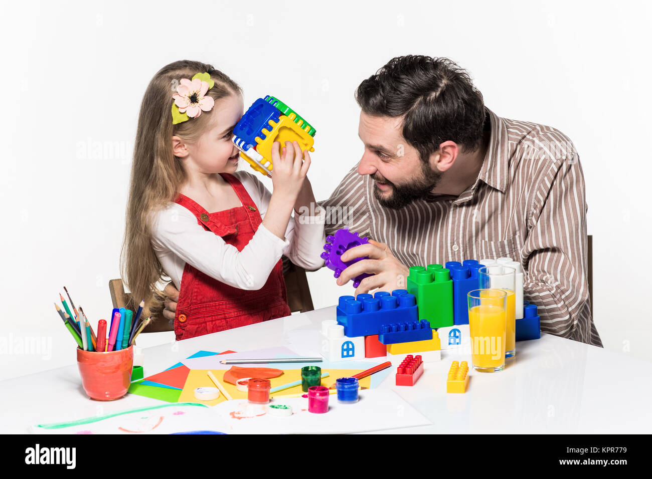 Father and daughter playing educational games together Stock Photo - Alamy