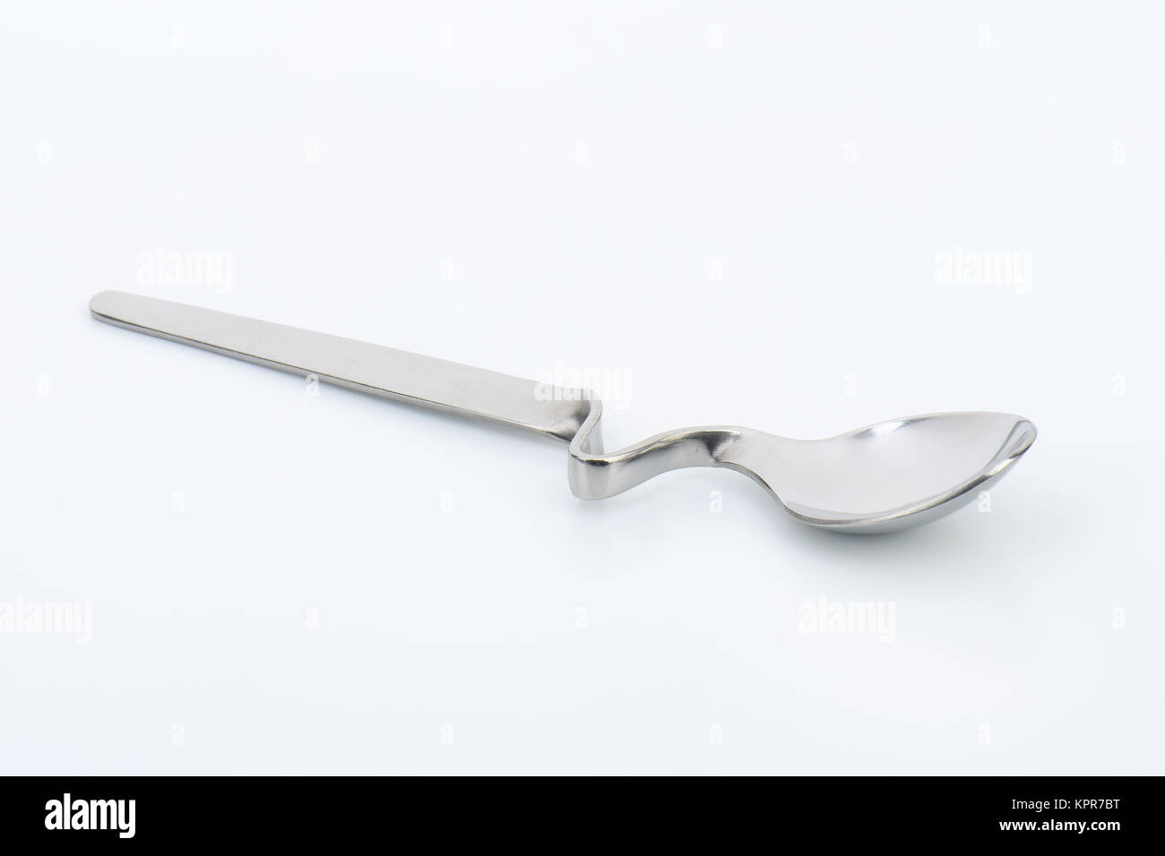 metal twisted spoon Stock Photo - Alamy