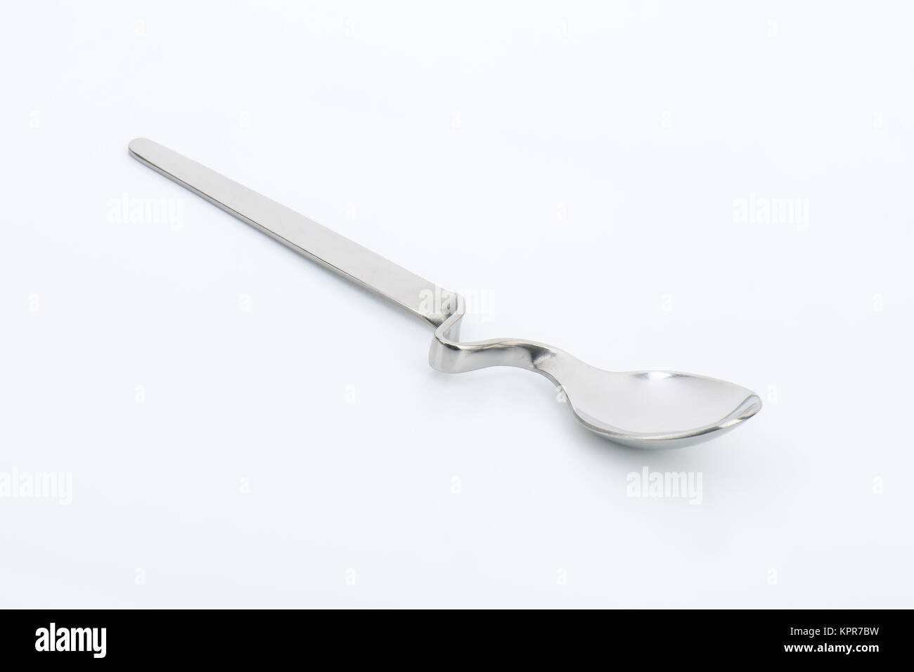 metal twisted spoon Stock Photo - Alamy
