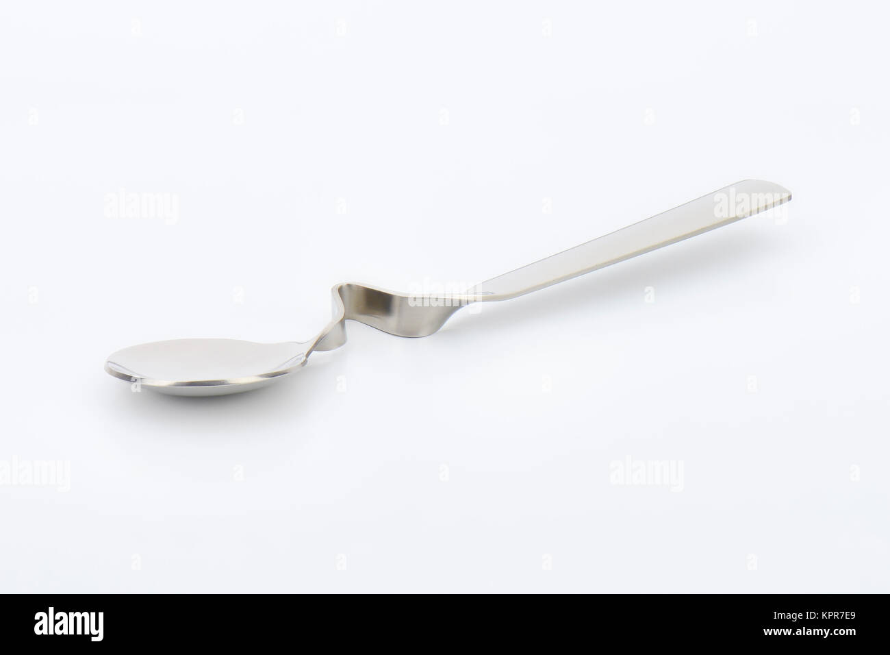 bent metal spoon Stock Photo - Alamy