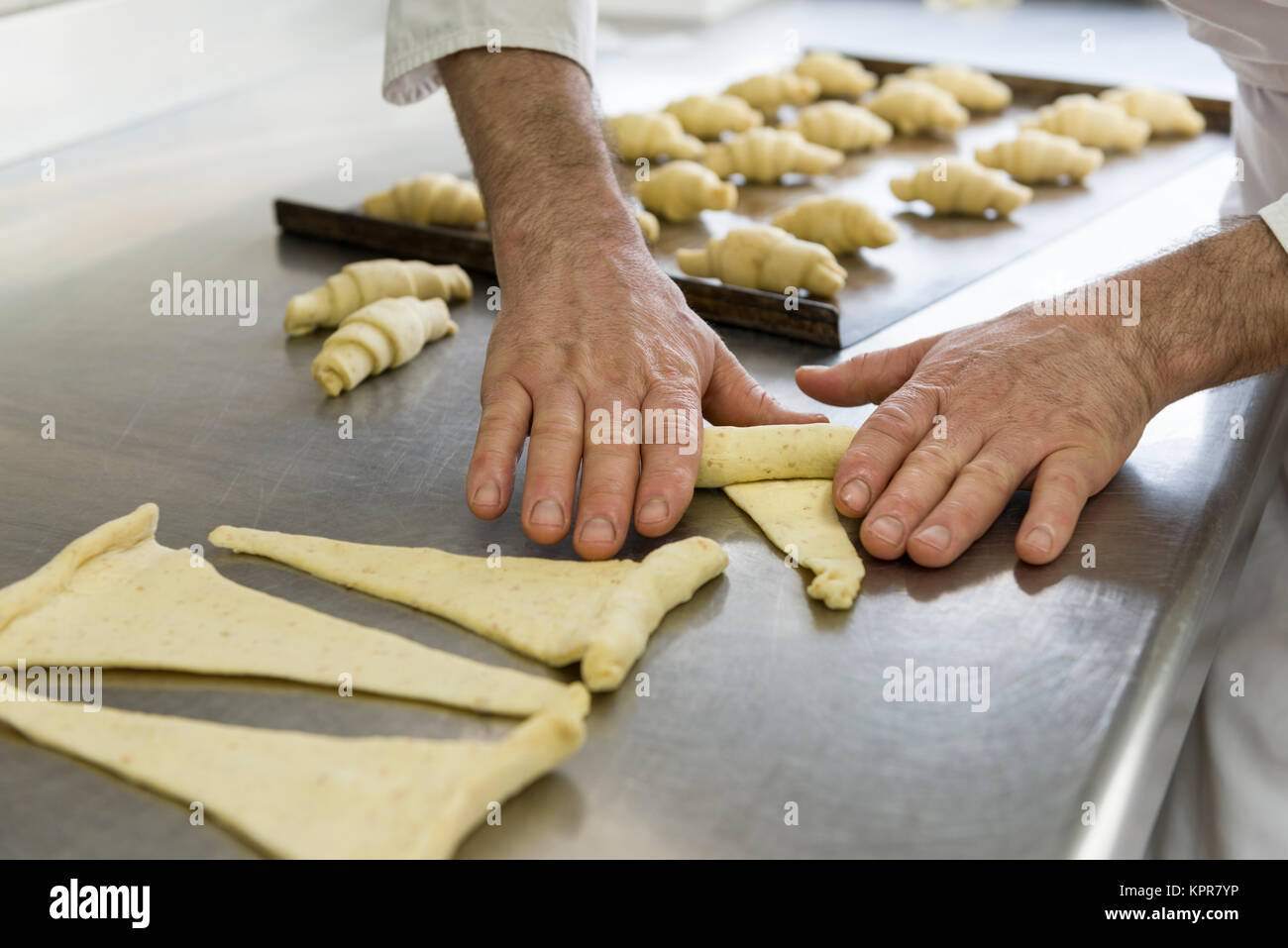pastry chef shapes the dough with your hands for cookies Stock Photo ...