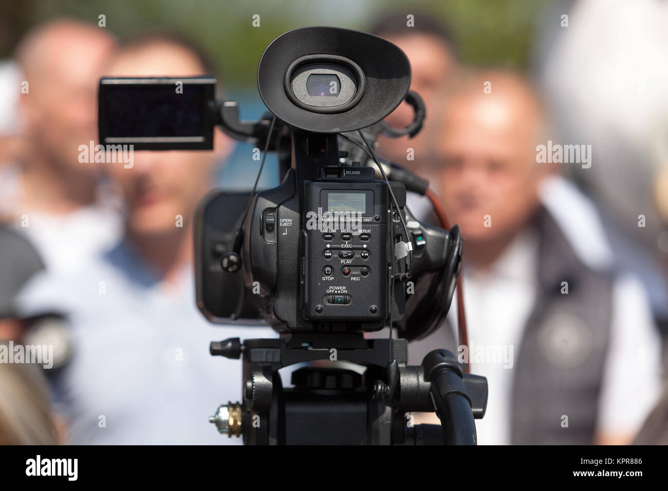 Filming an media event with a video camera Stock Photo - Alamy