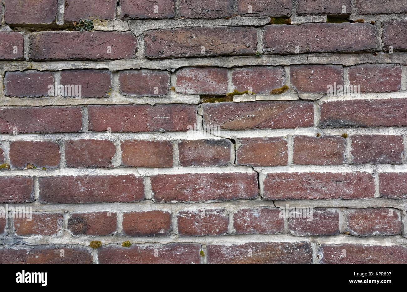 old brick wall with square tiles Stock Photo - Alamy