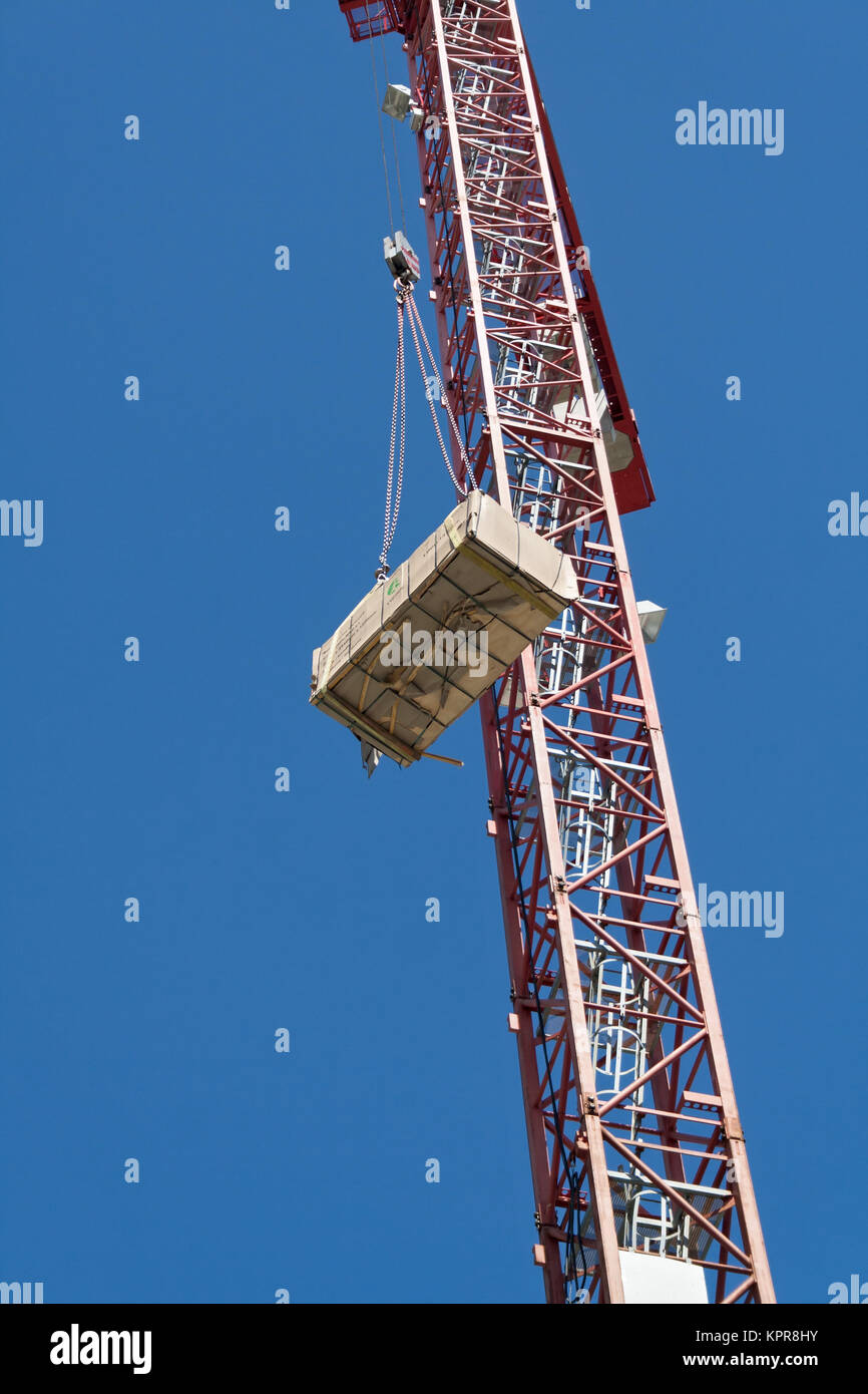 material loaded with a crane on a construction site Stock Photo - Alamy