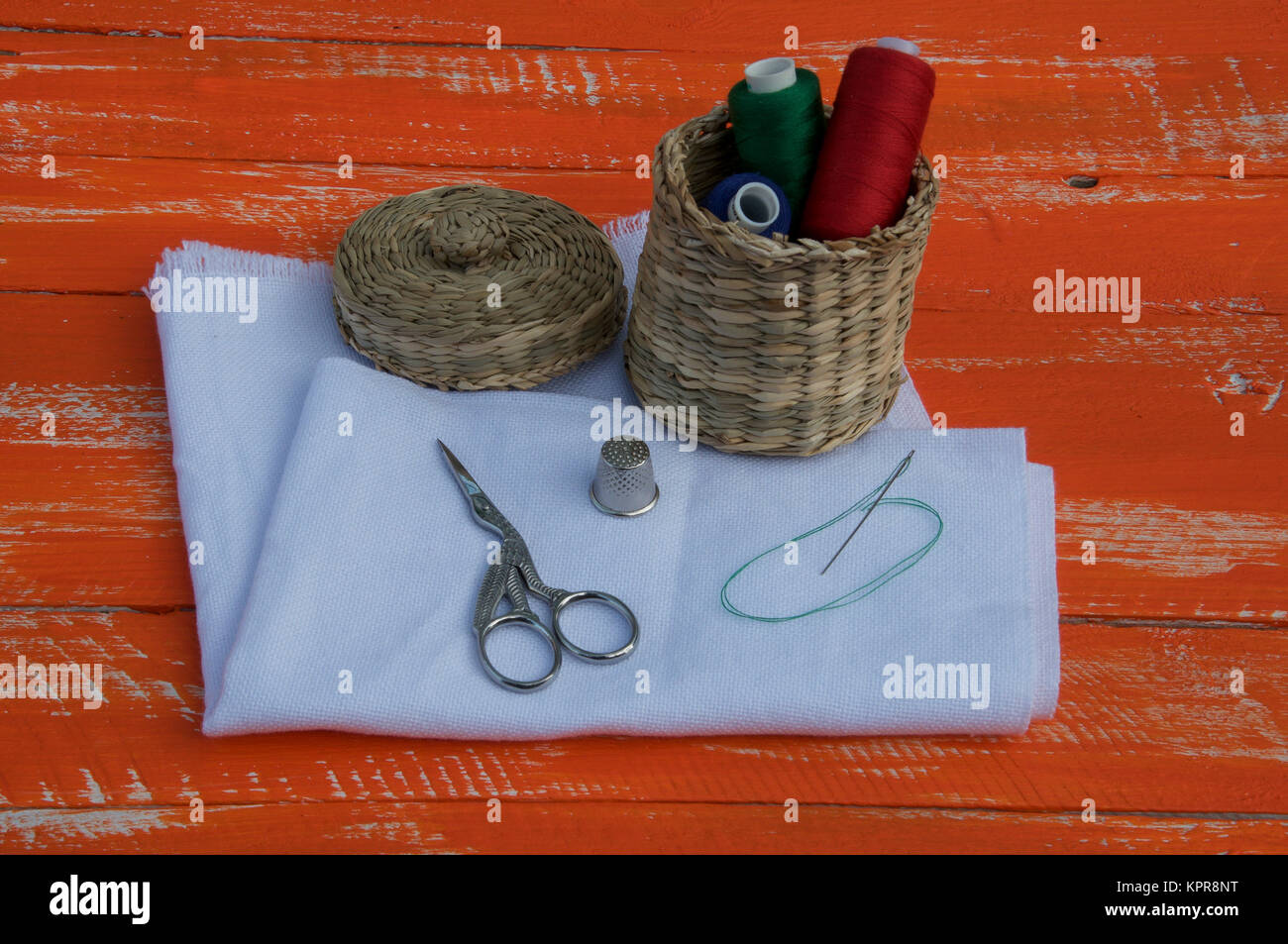 Fabric with objects for sewing and embroidery, orange tone Stock Photo ...