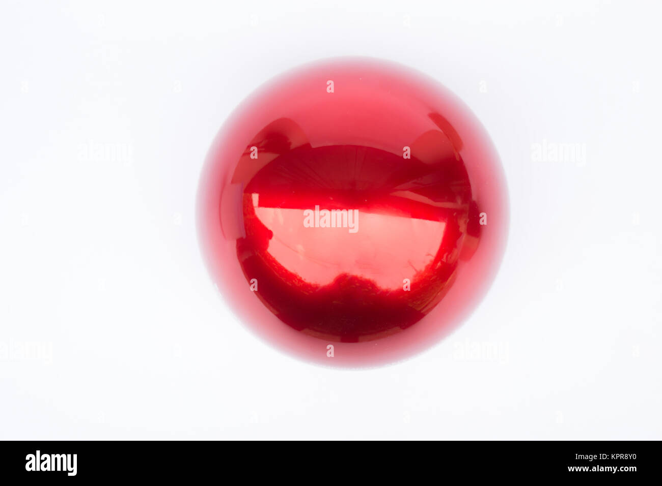 Shiny hard red ball on white background Stock Photo - Alamy