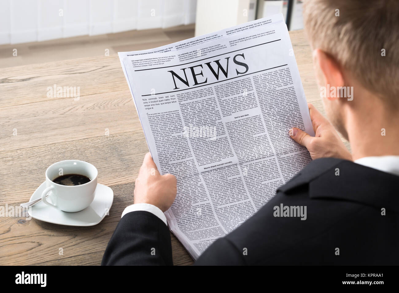Businessman Reading Newspaper In Office Stock Photo - Alamy Businessman Reading Newspaper In Office Stock Photo - Alamy