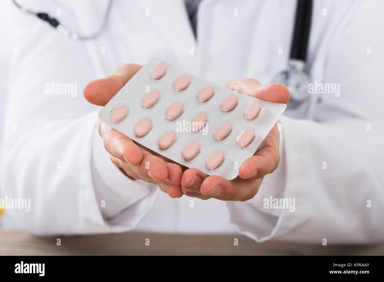 Male Doctor Holding Blister Packs Stock Photo - Alamy