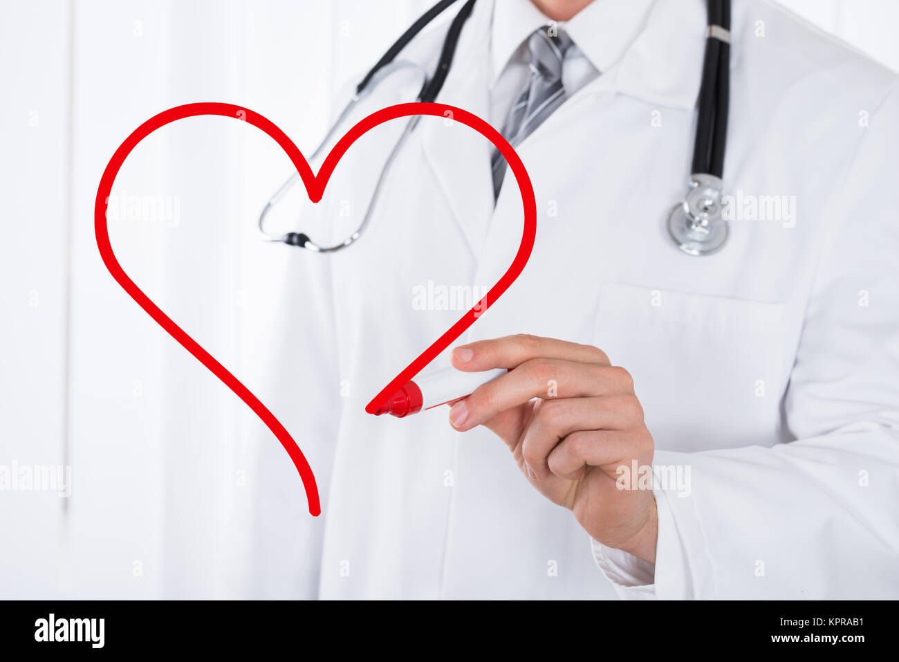 Close-up Of Doctor Hand Drawing A Heart Symbol Stock Photo - Alamy