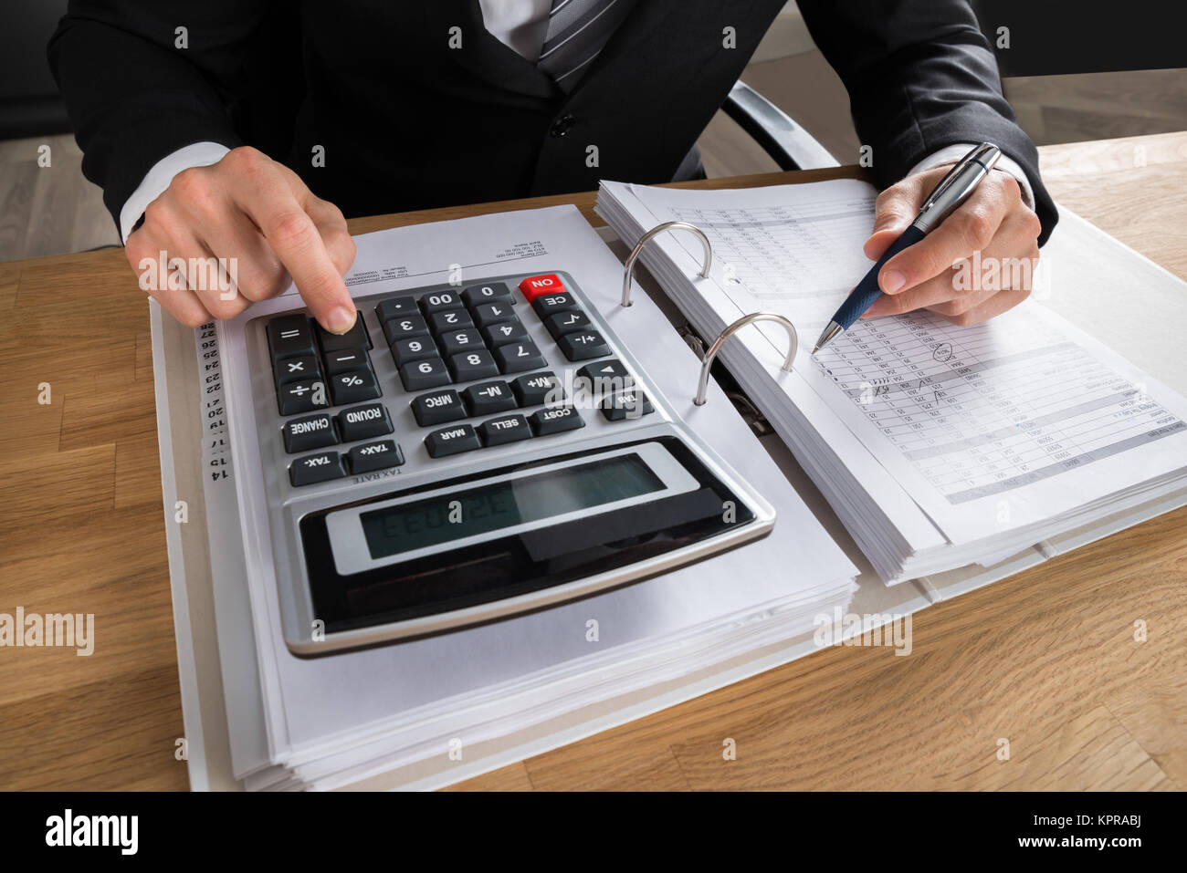 Male Accountant Calculating Tax Stock Photo - Alamy