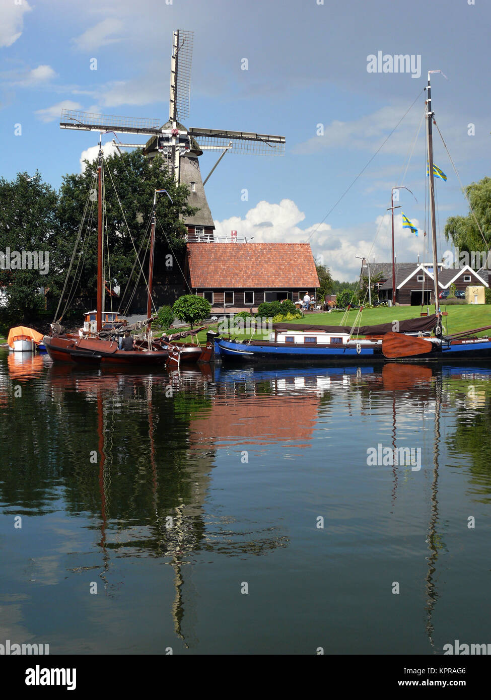 mill on the harbor dam in harderwijk Stock Photo - Alamy