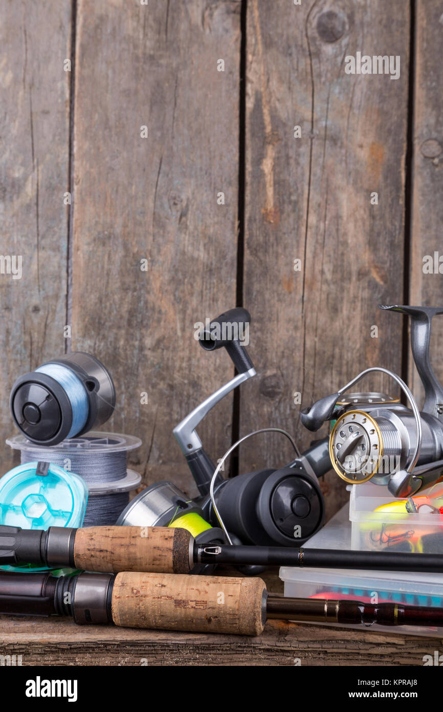 fishing tackles on vertical wooden board background Stock Photo - Alamy