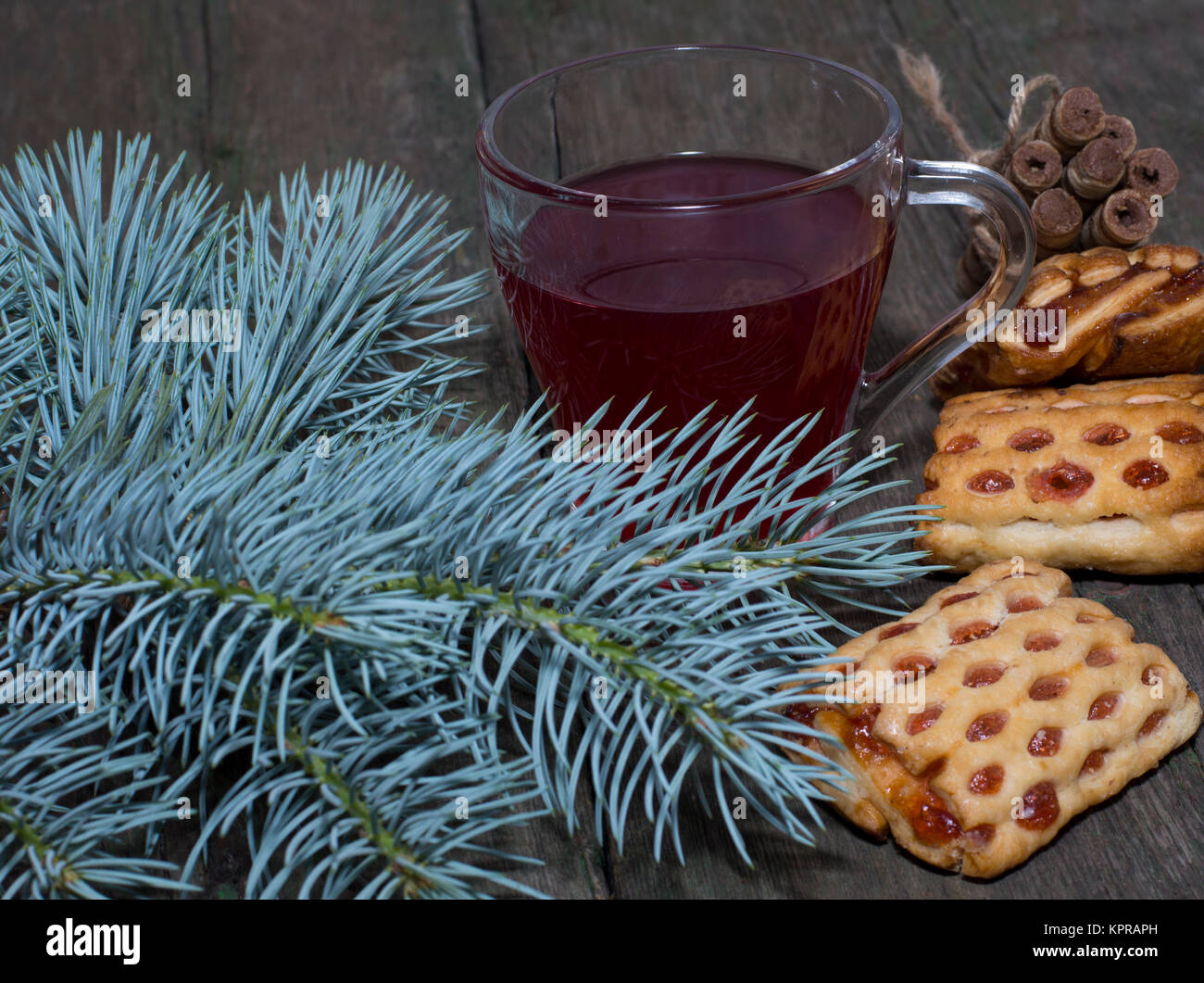 still life from a fir-tree branch, cookies and tea Stock Photo - Alamy