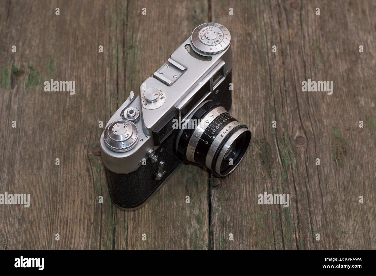 retro the camera on a wooden table a side view Stock Photo - Alamy