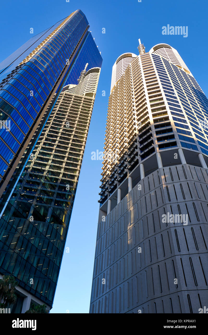 Modern high-rise buildings at Eagle Street Pier beside river in ...