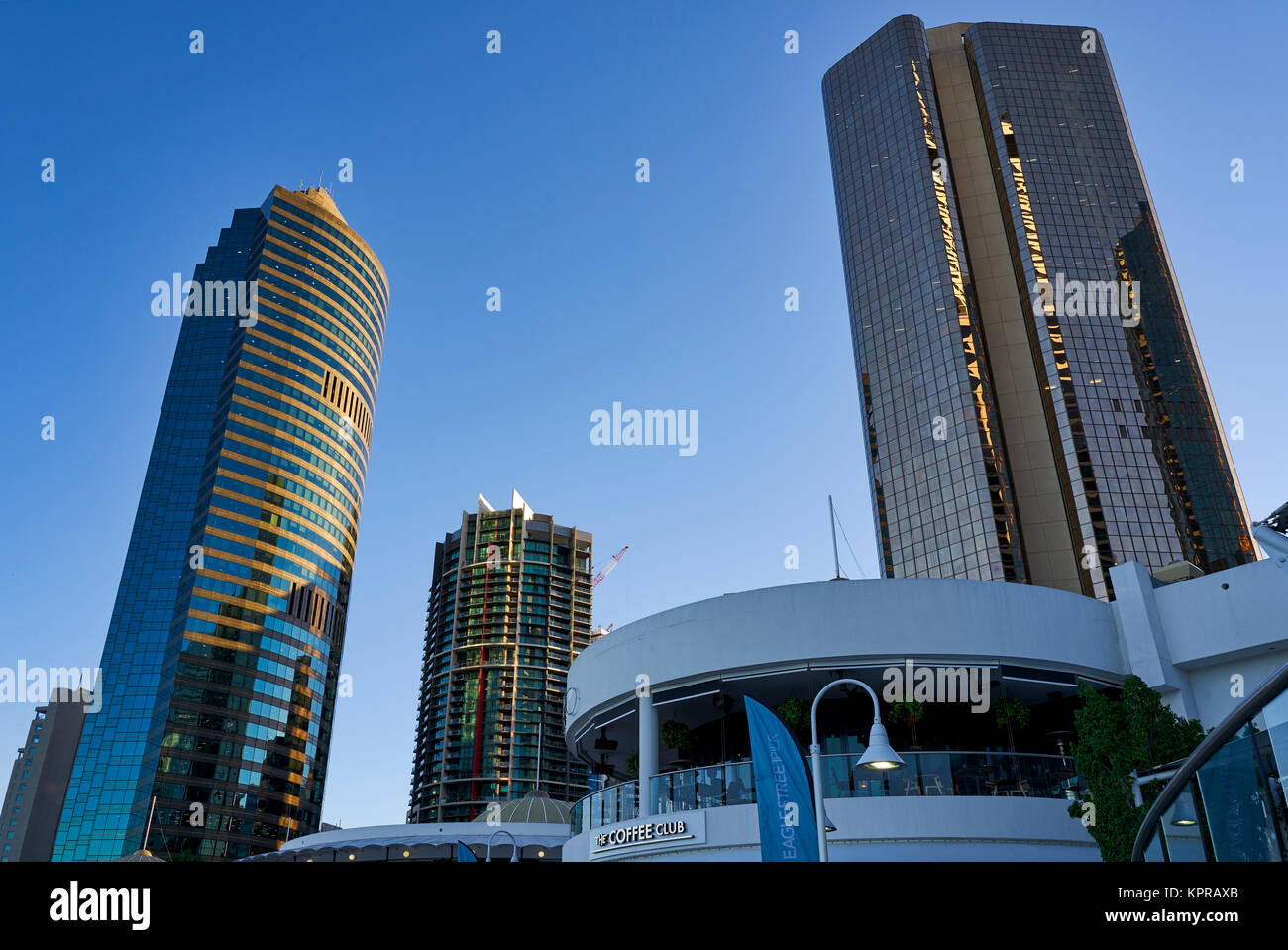 Modern high-rise buildings at Eagle Street Pier beside river in ...