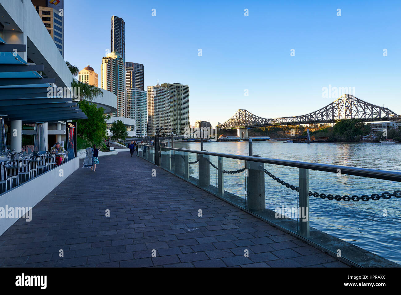 Modern high-rise buildings at Eagle Street Pier beside river in ...