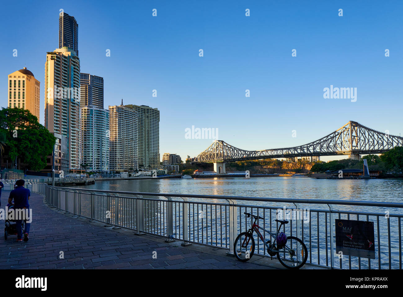 Modern high-rise buildings at Eagle Street Pier beside river in ...