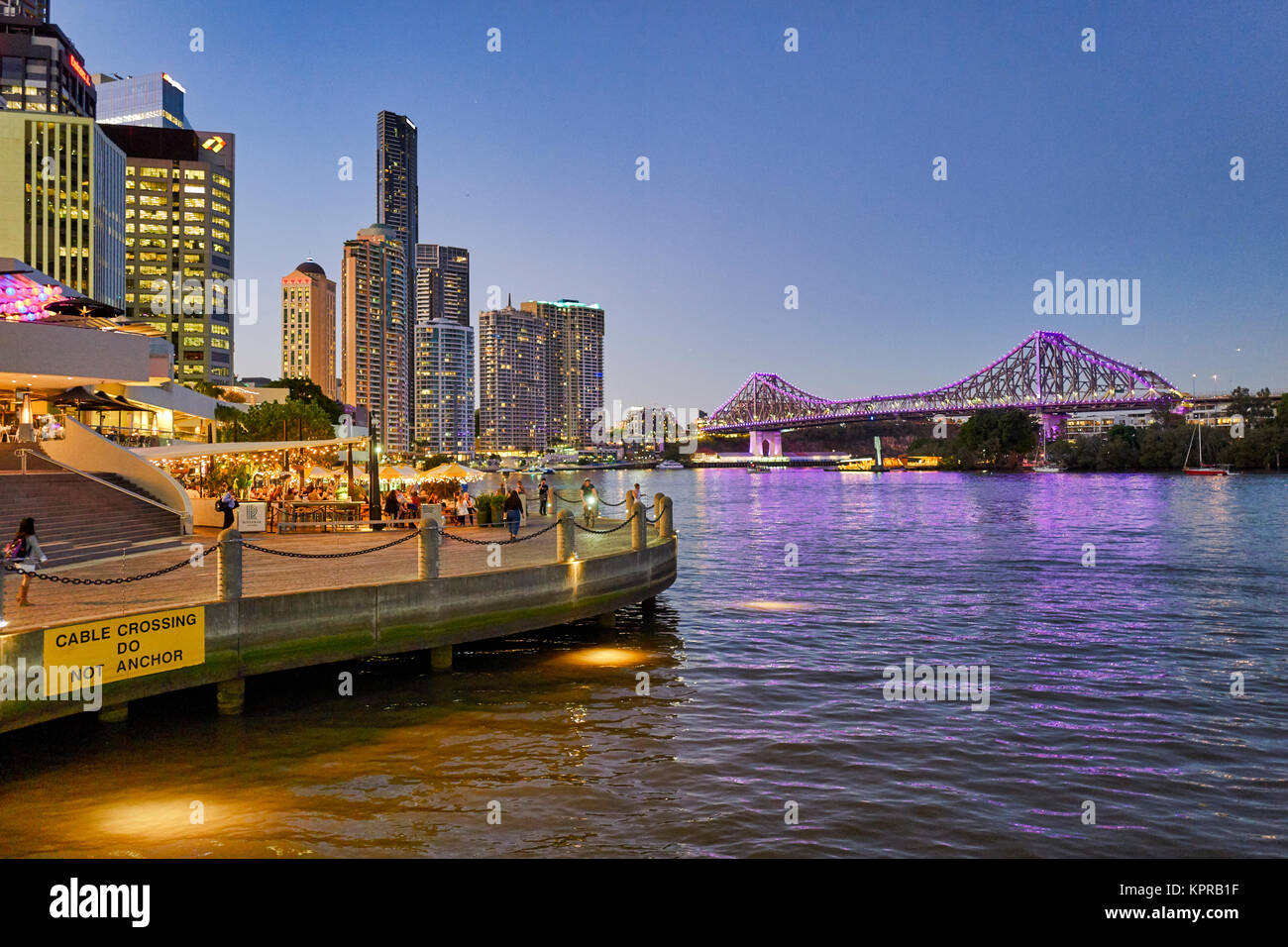 Modern high-rise buildings at Eagle Street Pier beside river in ...