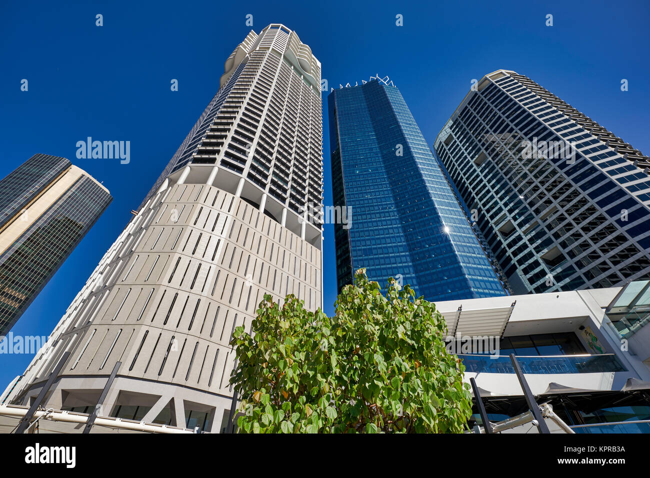 Modern high-rise buildings at Eagle Street Pier beside river in ...