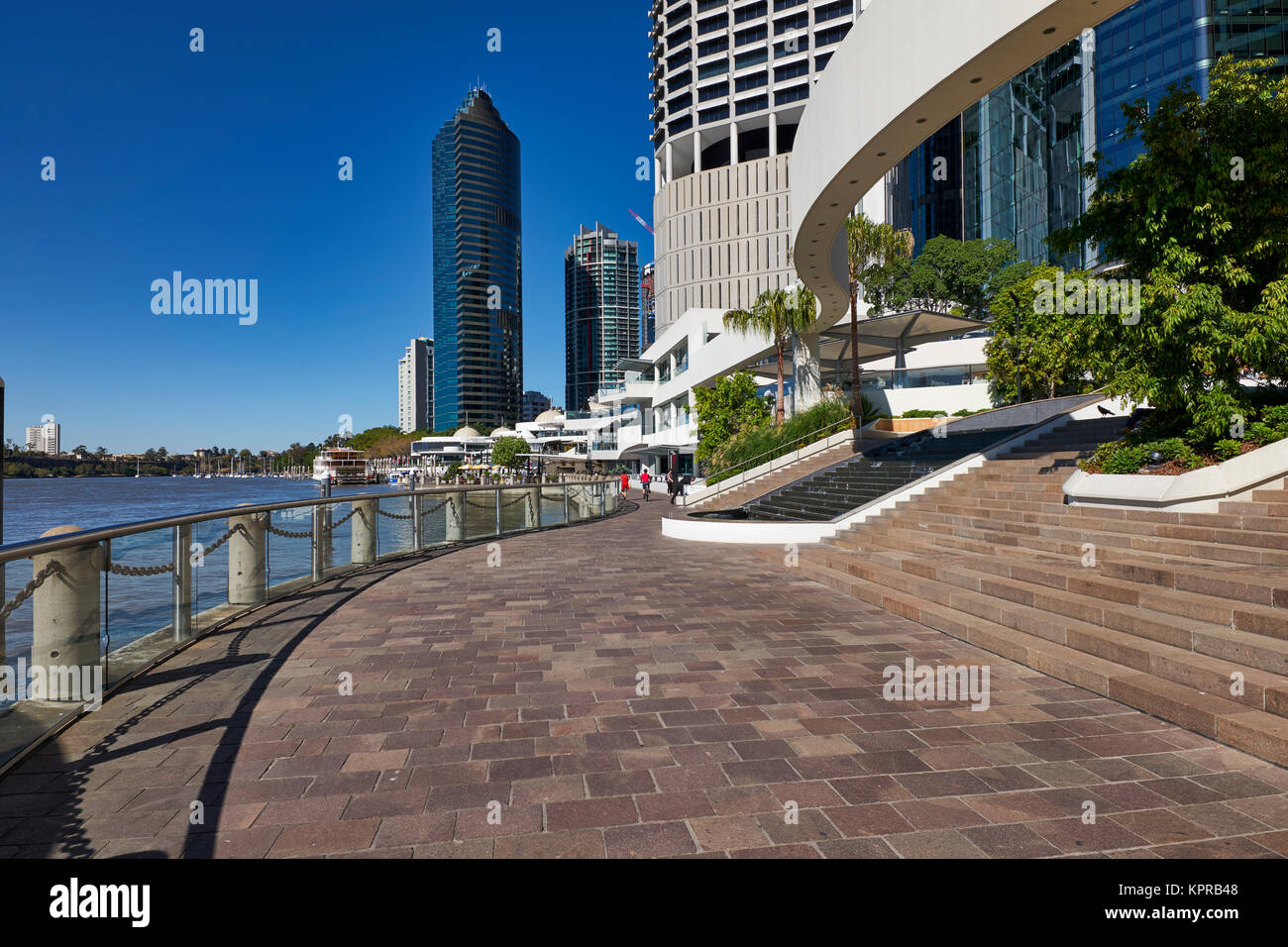 Modern high-rise buildings at Eagle Street Pier beside river in ...