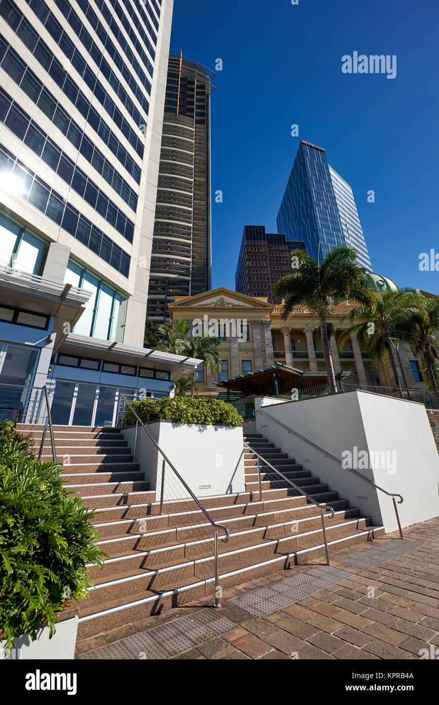Modern high-rise buildings at Eagle Street Pier beside river in ...