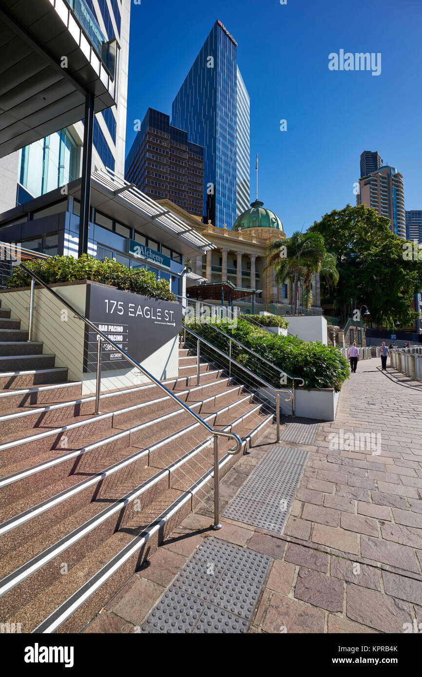 Modern high-rise buildings at Eagle Street Pier beside river in ...