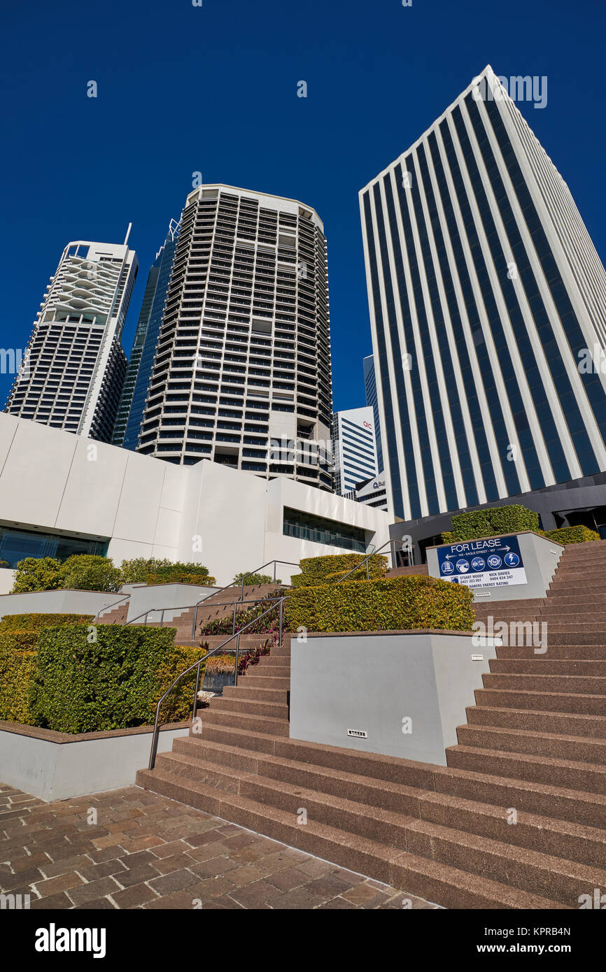 Modern high-rise buildings at Eagle Street Pier beside river in ...