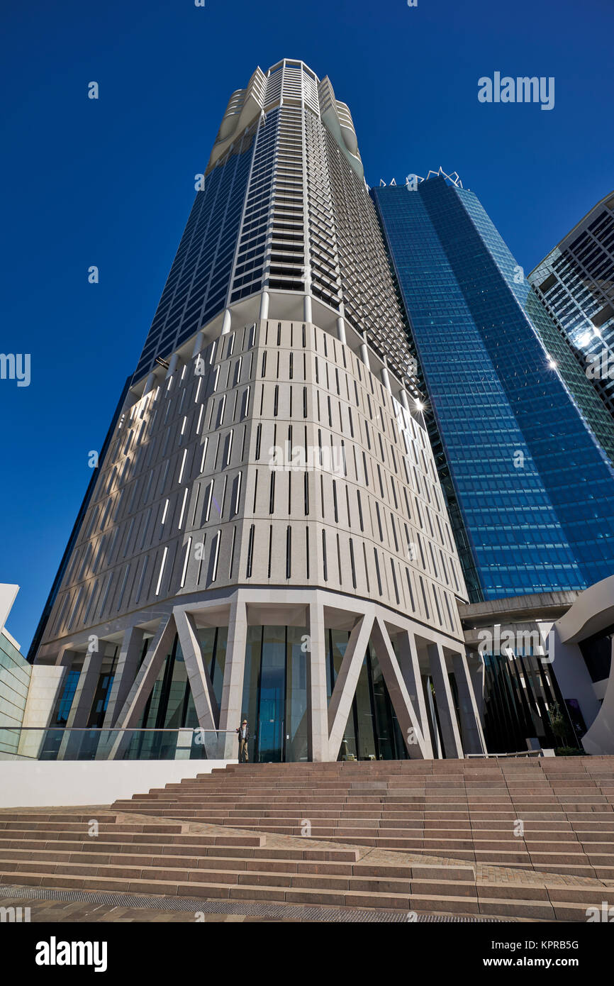 Modern high-rise buildings at Eagle Street Pier beside river in ...
