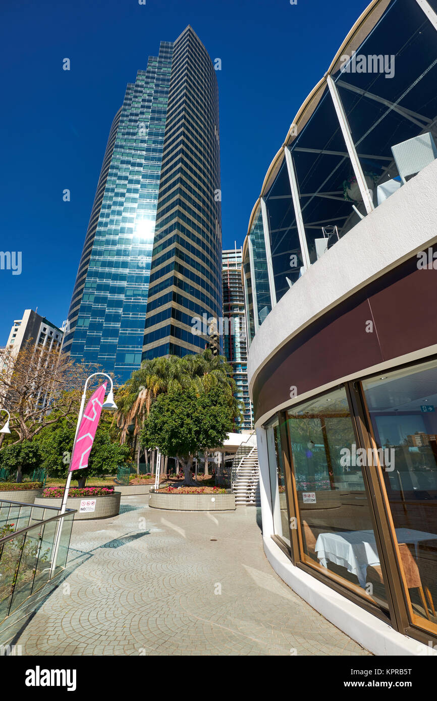 Modern high-rise buildings at Eagle Street Pier beside river in ...