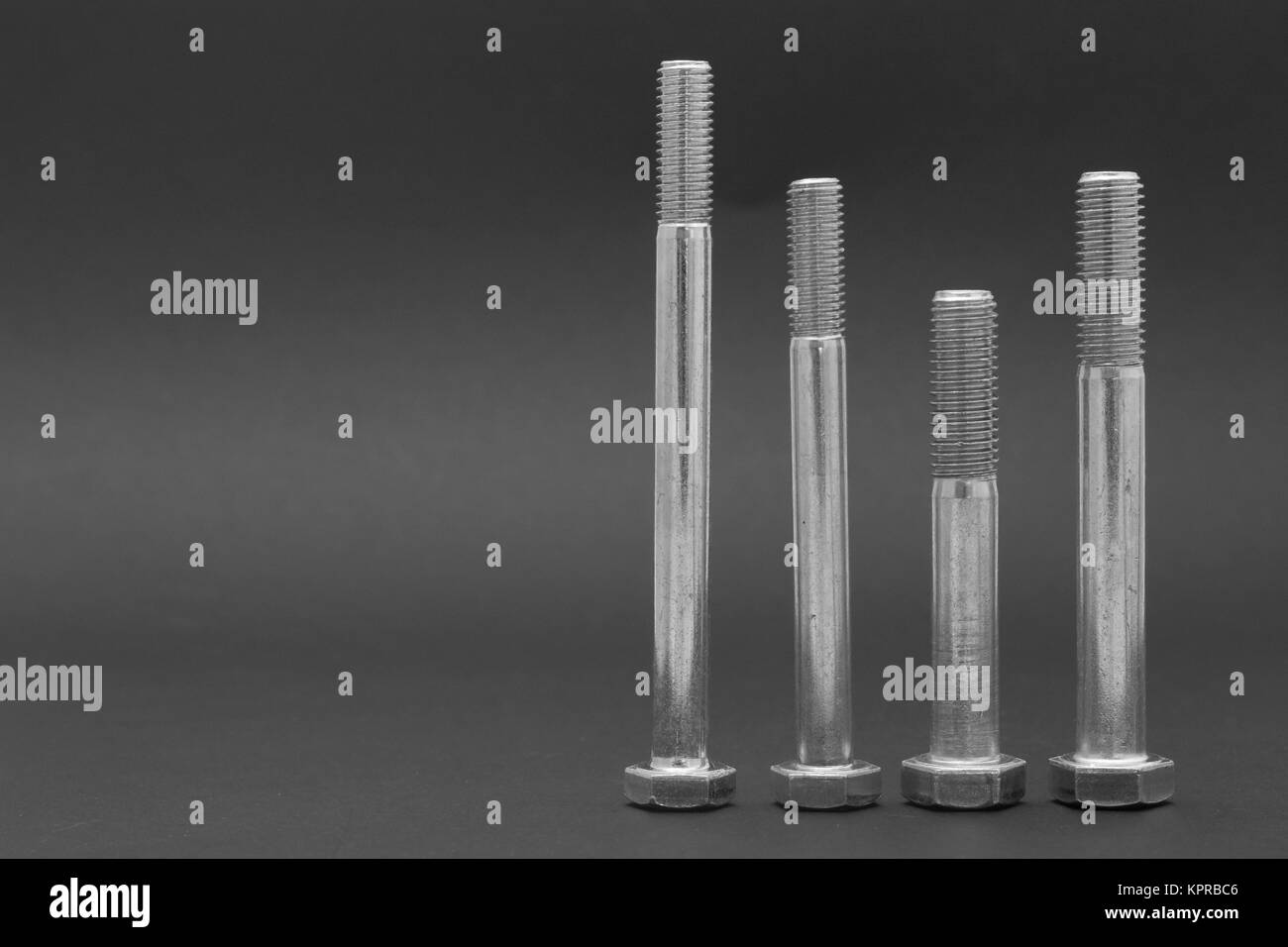 Various Isolated bolts on a dark background Stock Photo - Alamy