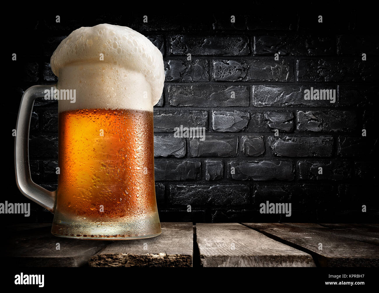 Beer and brick wall Stock Photo - Alamy