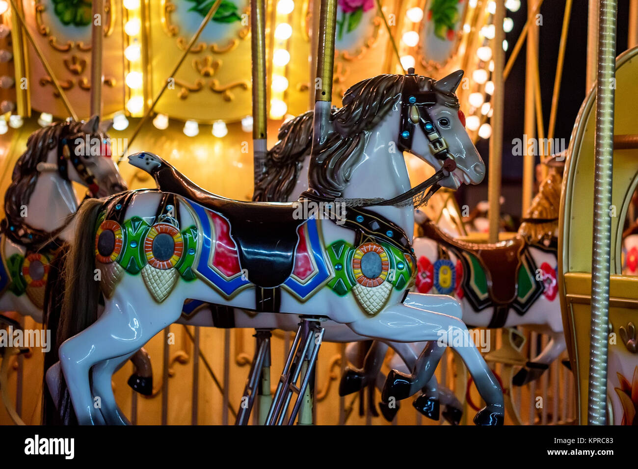Carousel at fun fair Stock Photo - Alamy