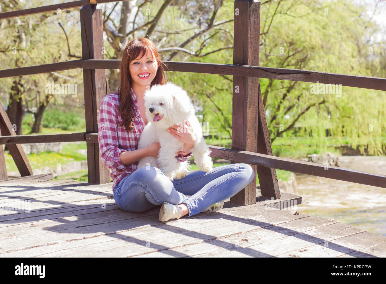 Happy Woman Enjoying Nature With Her Dog Stock Photo - Alamy