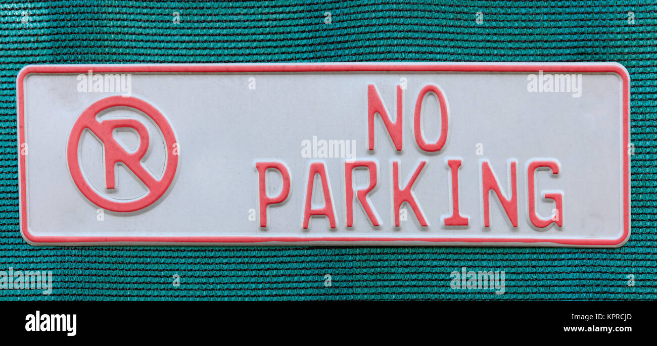 White and red no parking sign. Blue woven fabric background Stock Photo ...