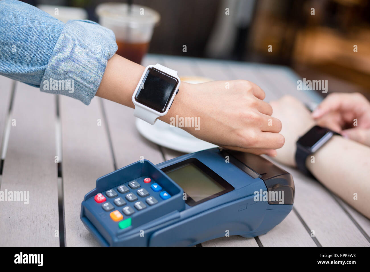 Woman using smart watch with NFC technology Stock Photo - Alamy