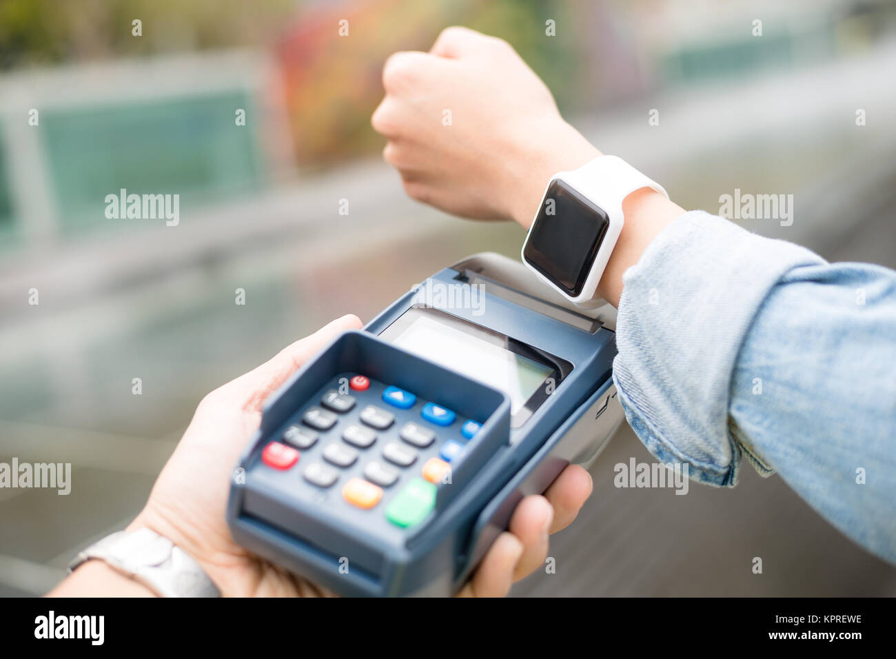 Woman pay on pos machine by NFC technology Stock Photo - Alamy