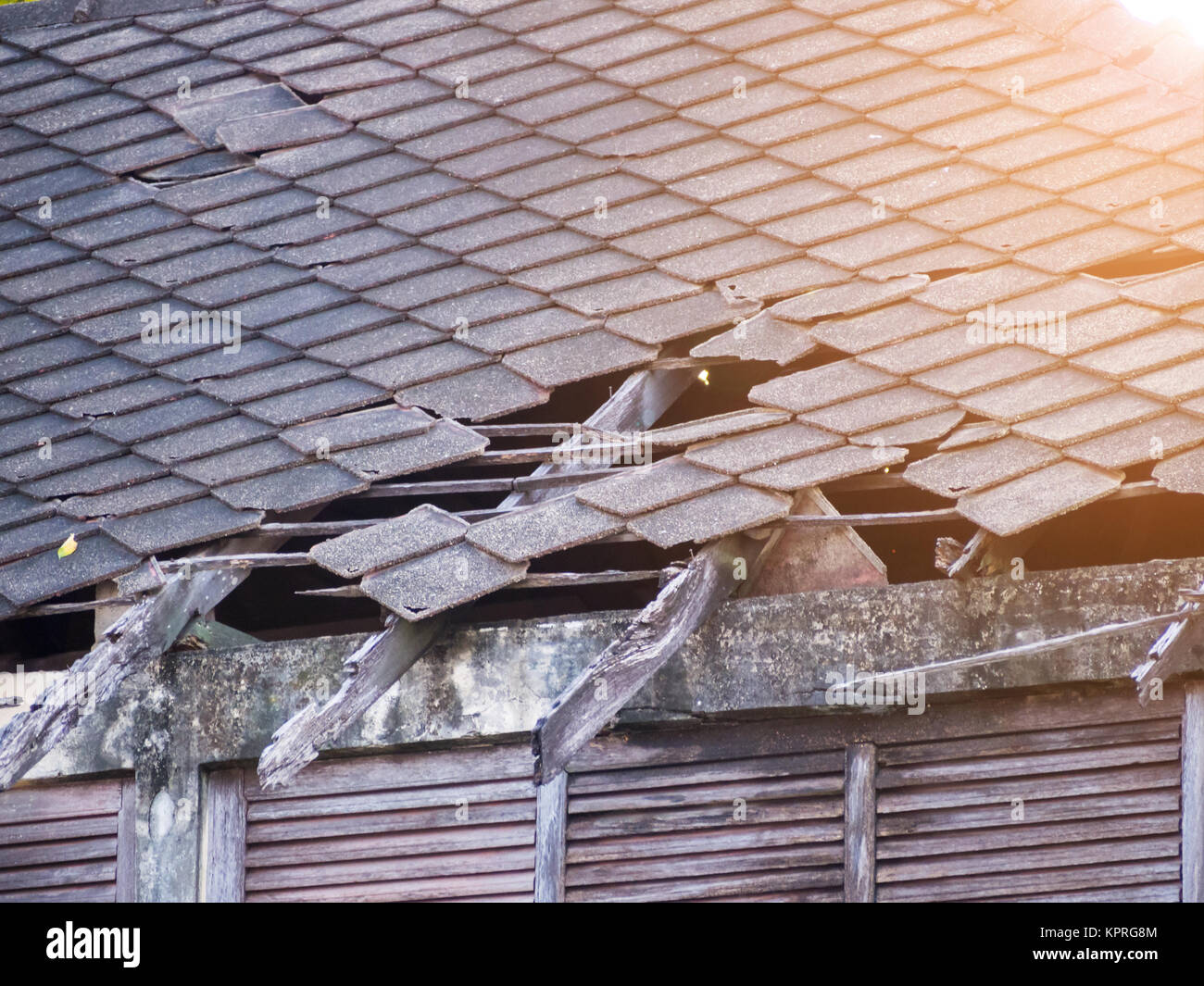 broken tile roof after rain strom Stock Photo - Alamy