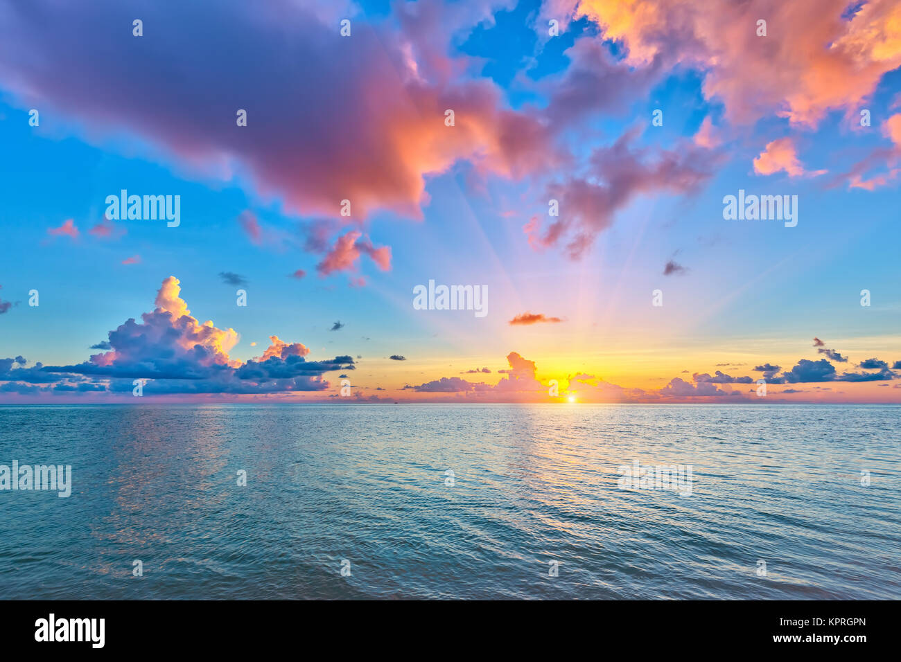 Sunrise over ocean Stock Photo - Alamy
