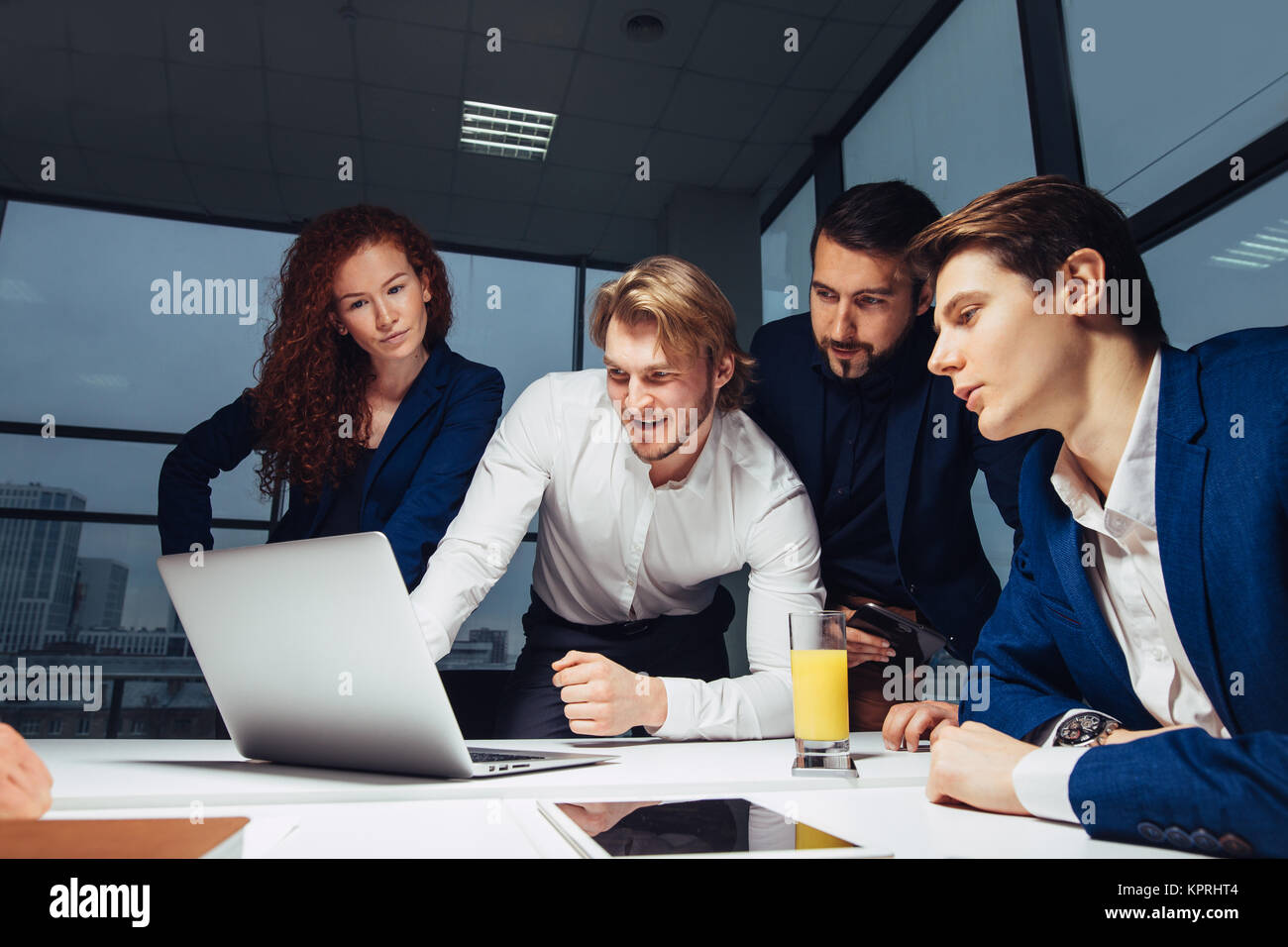 Co workers around computer hi-res stock photography and images - Alamy